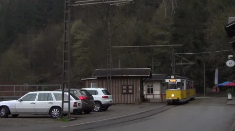 Two-car old yellow tram arrives to the L... | Stock Video | Pond5