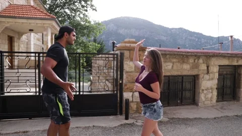 Two Caucasian Lebanese friends high five... | Stock Video | Pond5