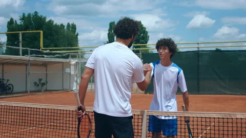 Two charismatic tennis players father an... | Stock Video | Pond5