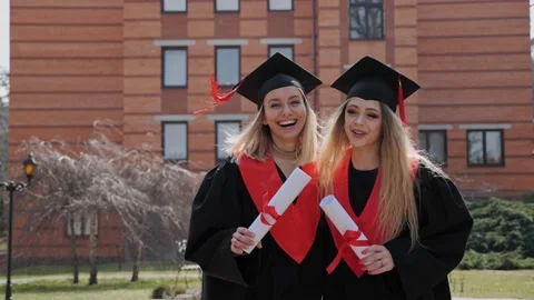 Two charming blonde girls go to the grad... | Stock Video | Pond5