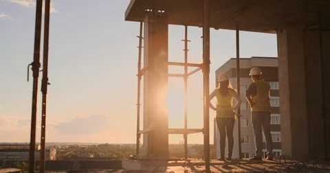 Two Chief Engineer with a drawing in han... | Stock Video | Pond5