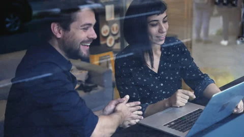 Two colleagues talking about work in fro... | Stock Video | Pond5