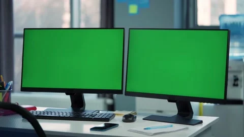 Two Computer Monitors with Mock Up Green... | Stock Video | Pond5