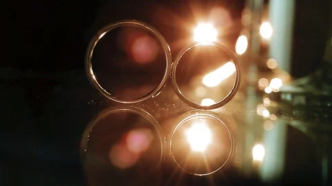 Two cool gold wedding rings. Beautiful c... | Stock Video | Pond5