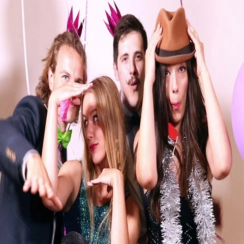 Two cute couples having fun in party pho... | Stock Video | Pond5