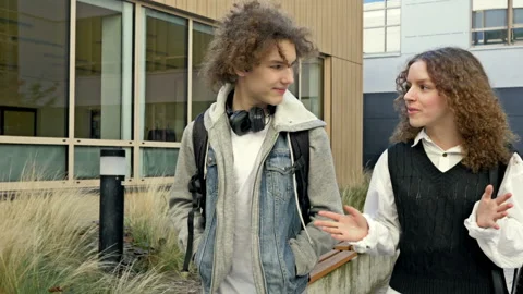 Two cute high school students, a guy and... | Stock Video | Pond5