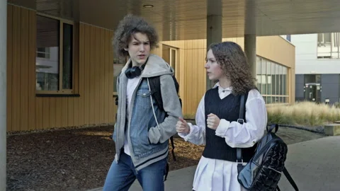 Two cute high school students, a guy and... | Stock Video | Pond5