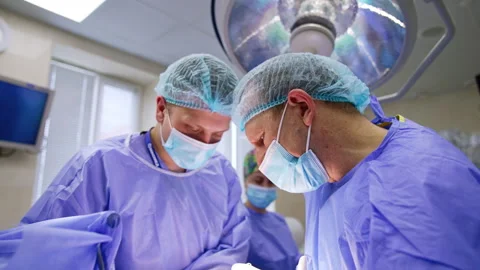Two doctors co-working at surgery in mod... | Stock Video | Pond5
