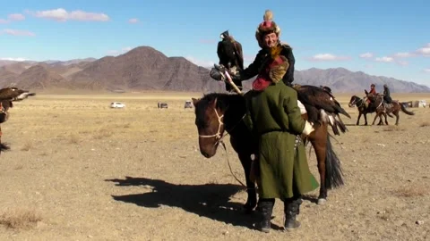 Two Eagle Hunters Talking in Western Mon... | Stock Video | Pond5