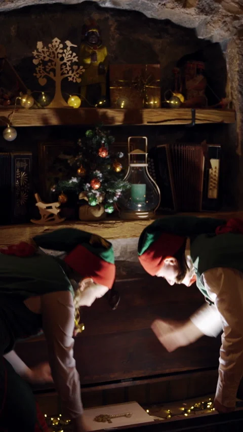 Two elves in a dark room open the big ch... | Stock Video | Pond5