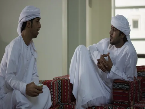 Two Emirati men sitting together and tal... | Stock Video | Pond5