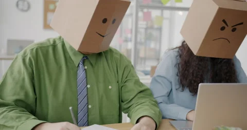 Two employees with emoji faces working i... | Stock Video | Pond5