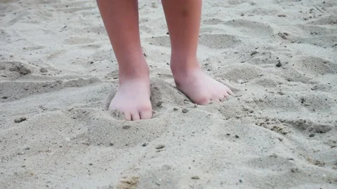 Two feet of a little boy pulling his toe... | Stock Video | Pond5
