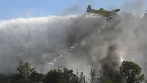 Two firefighting airtankers drop fire re... | Stock Video | Pond5