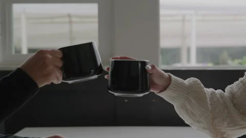 Two Friends Cheers Their Coffee Mugs Tog... | Stock Video | Pond5