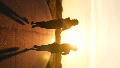 two friends running sunset, team group g... | Stock Video | Pond5