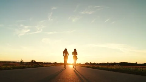 two friends running sunset, team group g... | Stock Video | Pond5