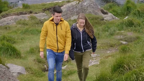 Two friends wander through the nature of... | Stock Video | Pond5