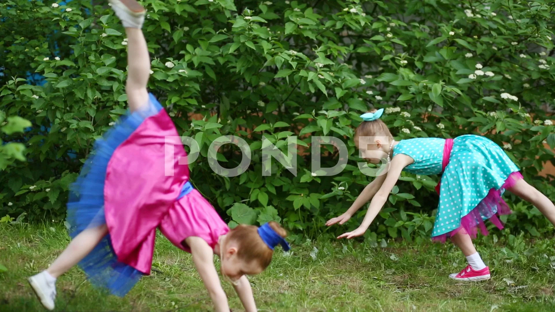 Two People Doing A Cartwheel