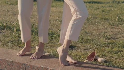 Two girls barefoot. Photo session on the... | Stock Video | Pond5