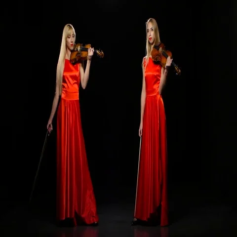 Two girls blonde playing the fiddle. Stu... | Stock Video | Pond5