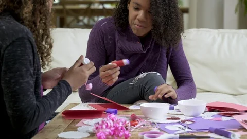 Two girls craft making together at table... | Stock Video | Pond5