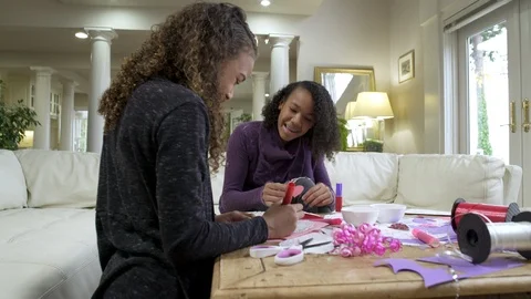 Two girls craft making together at table... | Stock Video | Pond5