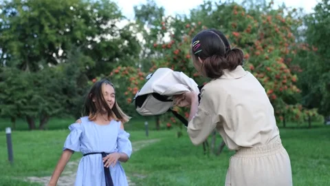 Two girls fight with school backpacks an... | Stock Video | Pond5