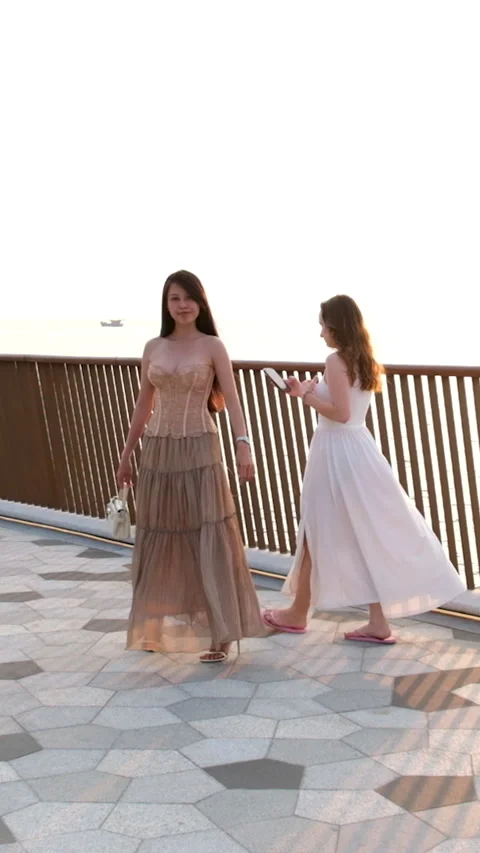 two girls friends walking on the bridge ... | Stock Video | Pond5