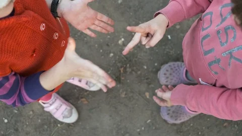Two girls playing Rock Paper Scissors ga... | Stock Video | Pond5