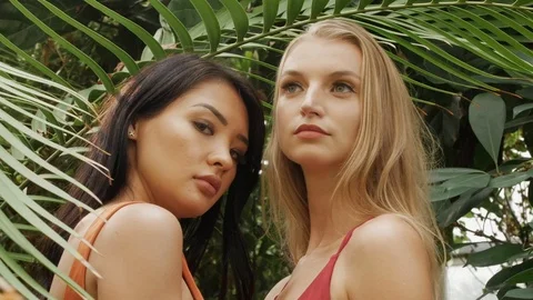 Two girls posing in swimsuits | Stock Video | Pond5