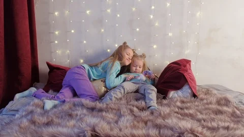 Two girls sisters playing hide and seek ... | Stock Video | Pond5