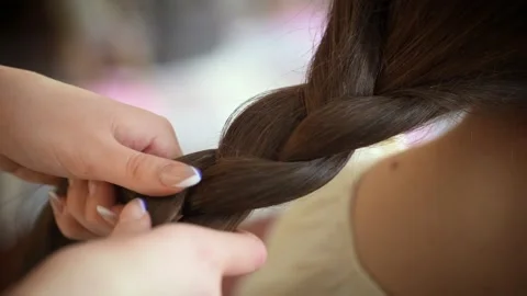 Two girls in Slavic clothes weave braids... | Stock Video | Pond5