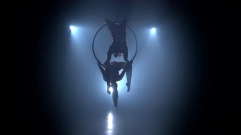 Two girls spinning on a hoop on stage. B... | Stock Video | Pond5