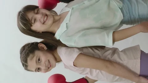 Two girls standing side by side isolated... | Stock Video | Pond5