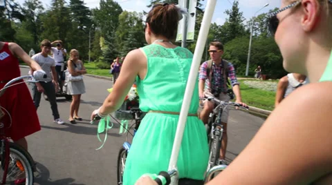 Two girls on tandem on cycle parade Lady... | Stock Video | Pond5