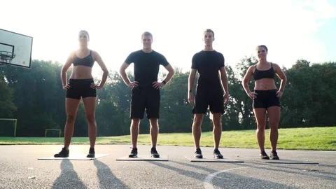 two girls two boys doing 6 count burpees | Stock Video | Pond5
