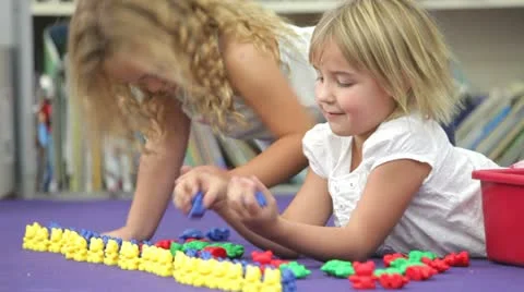 Two Girls Using Plastic Model Toys In Ma... | Stock Video | Pond5