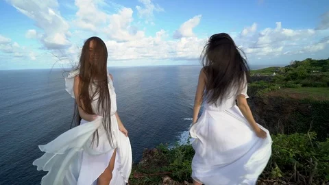 Two girls in white dresses with long hai... | Stock Video | Pond5