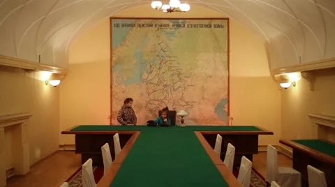 Two girls at wide table hold handsets in... | Stock Video | Pond5