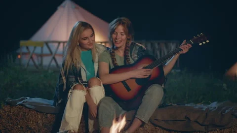Two good friends at the campsite sitting... | Stock Video | Pond5
