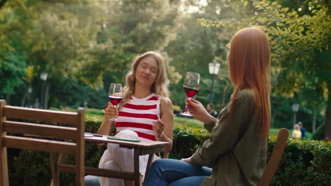 Two good looking friends sitting at a wo... | Stock Video | Pond5