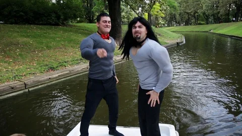 Two good-looking funny men dressed in fa... | Stock Video | Pond5