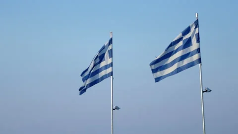 Two Greek flags flutter in the wind, cle... | Stock Video | Pond5