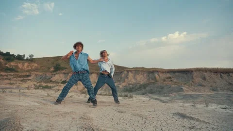 Two guy dancers dance modern dance in th... | Stock Video | Pond5