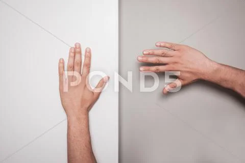 Two hands against a green and white background Stock Image #57483641
