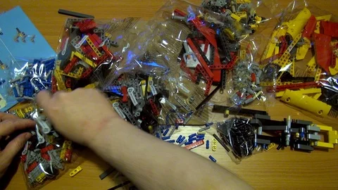 Two Hands constructing Technic Lego | Stock Video | Pond5