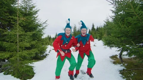 Two happy elves jumping together | Stock Video | Pond5