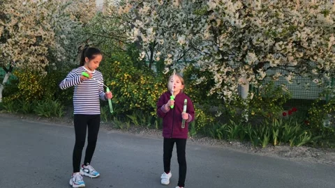 Two happy girls, sisters of ten and six ... | Stock Video | Pond5