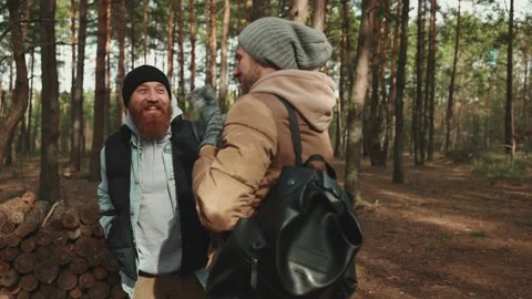 Two happy hiker friends talking while st... | Stock Video | Pond5